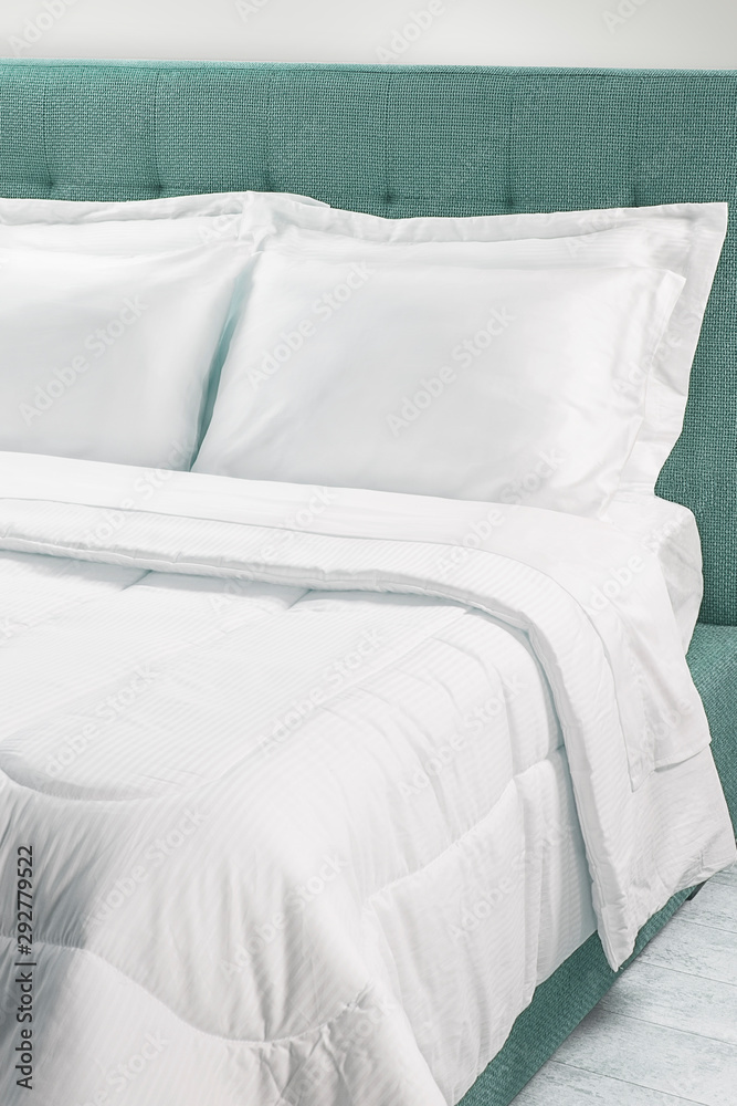 Modern bedroom with set of pillows on bed, interior design concept ...