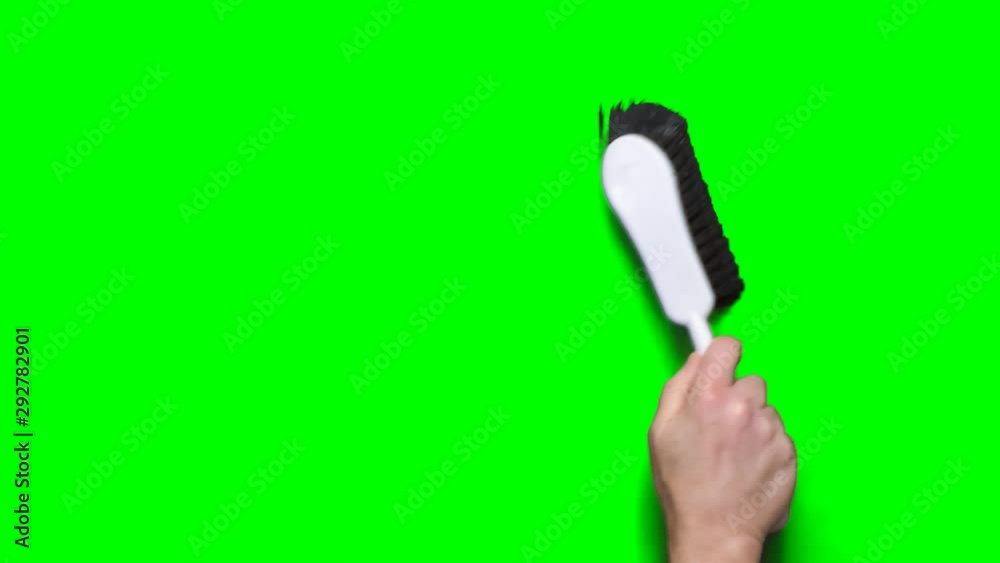 Vidéo Stock Male hand sweeping blank chroma key green surface with hand ...
