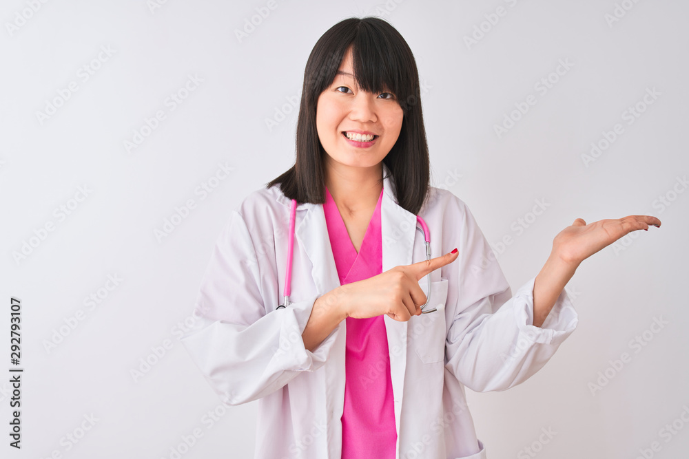 Young beautiful chinese doctor woman wearing stethoscope over isolated ...