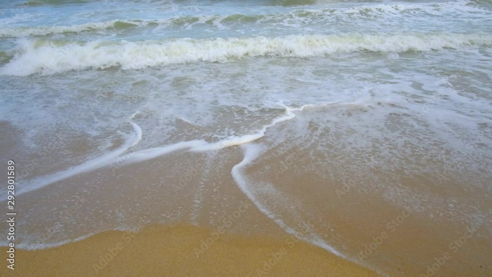 Beautiful background transparent surface wave, sand on clean seaside ...
