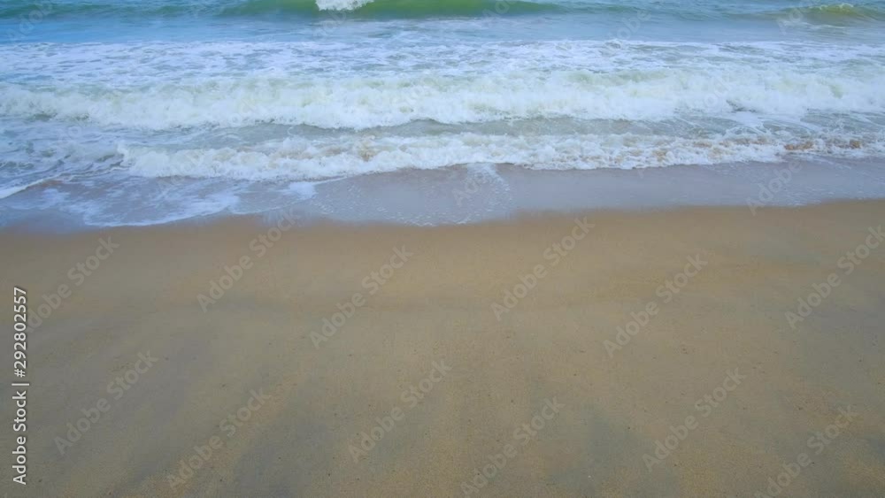 Beautiful background transparent surface wave, sand on clean seaside ...