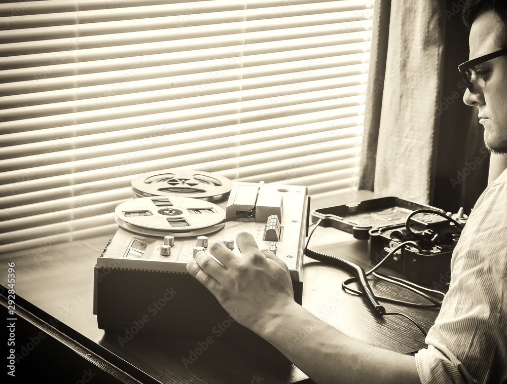 Special agent holds field telephone set USSR. Officer wiretapping on ...