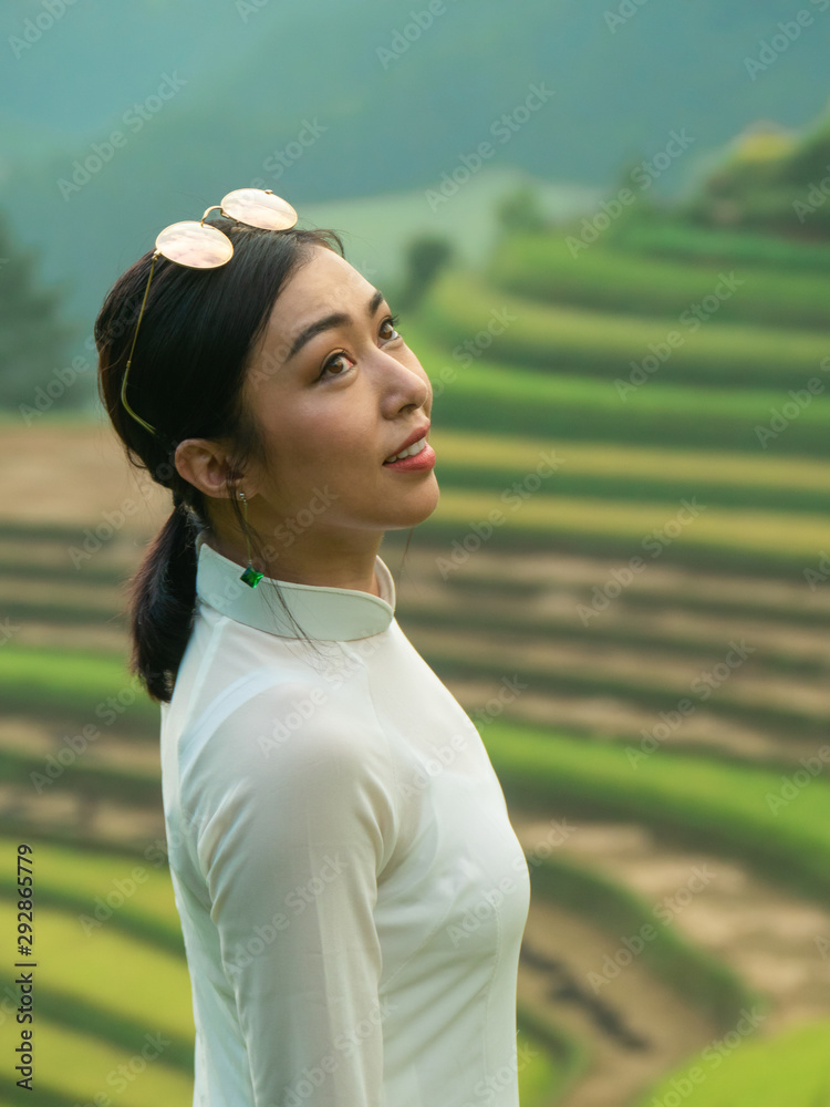 Beautiful women in white Vietnamese costume(ao dai) at Mu cang chai rice terraces, north Vietnam ...