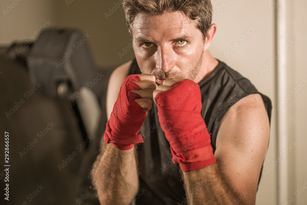 lifestyle gym portrait of young attractive and fierce looking man ...