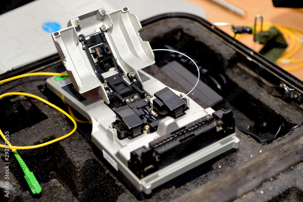 Fusion splicing fiber optic machine in network. Preparation of a fiber ...