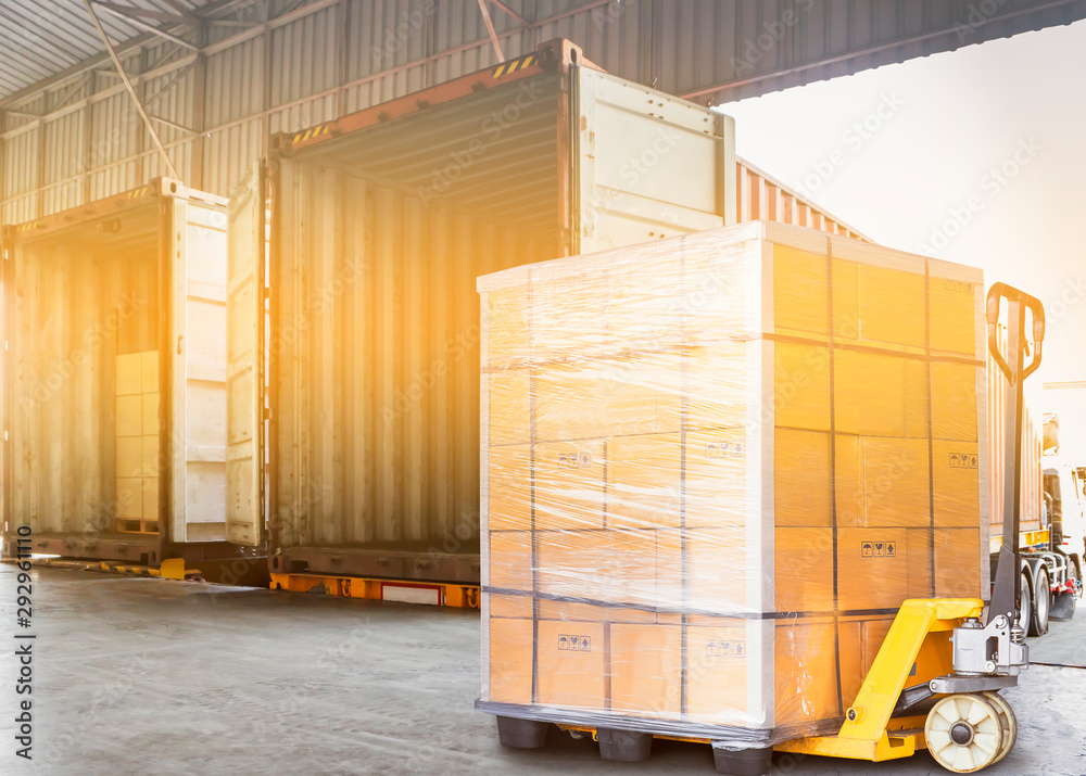 hand pallet truck with cargo shipment pallet for load into a truck ...