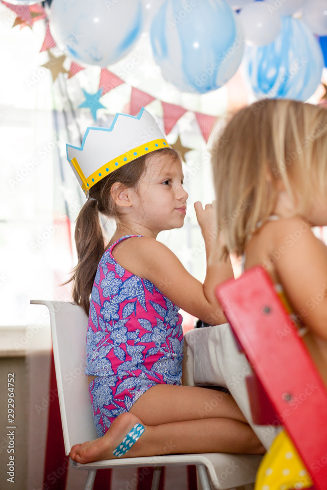 Little girls in bathing suits at a party sitting at a table Stock Photo ...