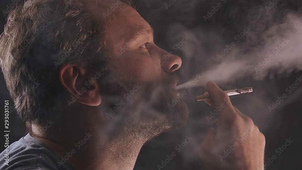 Full Head Face Young Man Smoking indoor cigarette smog with nicotine ...