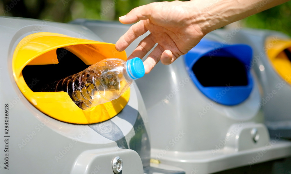 Please dispose of plastic bottle into the tank. A man throw rubbish in ...