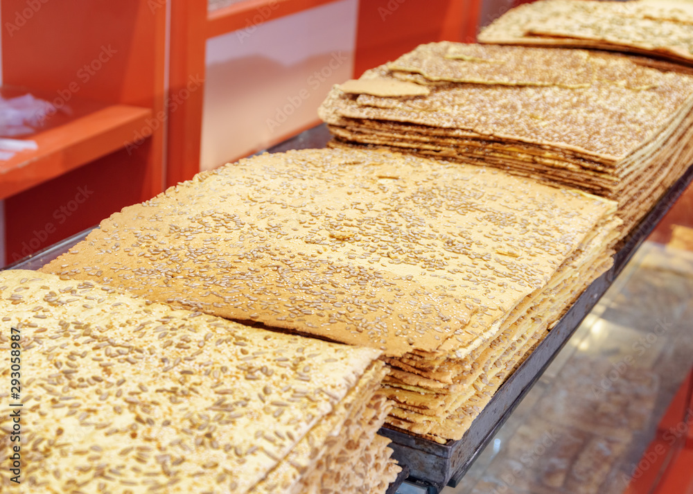 Traditional Iranian Sangak Bread topped with sesame seeds Stock Photo ...