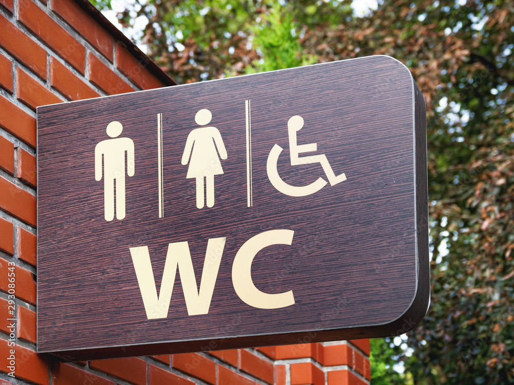 Public toilet. Sign for man, woman, disabled person and the letters WC ...