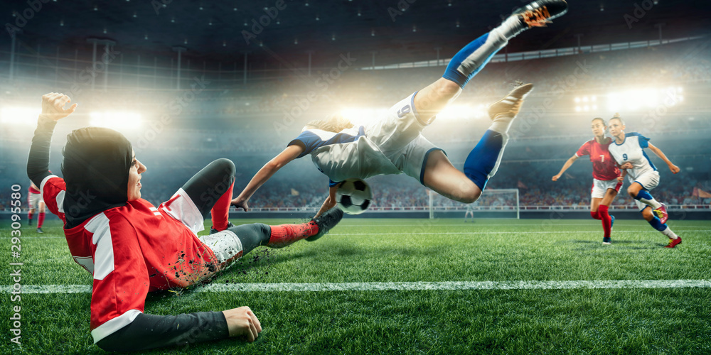 Female muslim soccer player in hijab shows exciting play during the ...