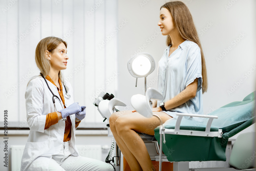 Gynecologist preparing for an examination procedure for a pregnant ...