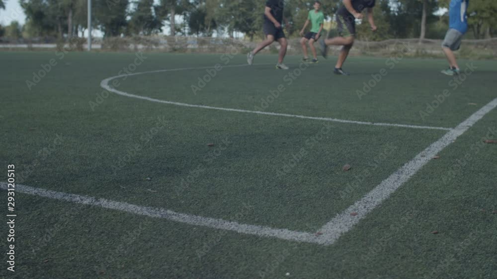 Low section of football player taking corner kick on the pitch during ...