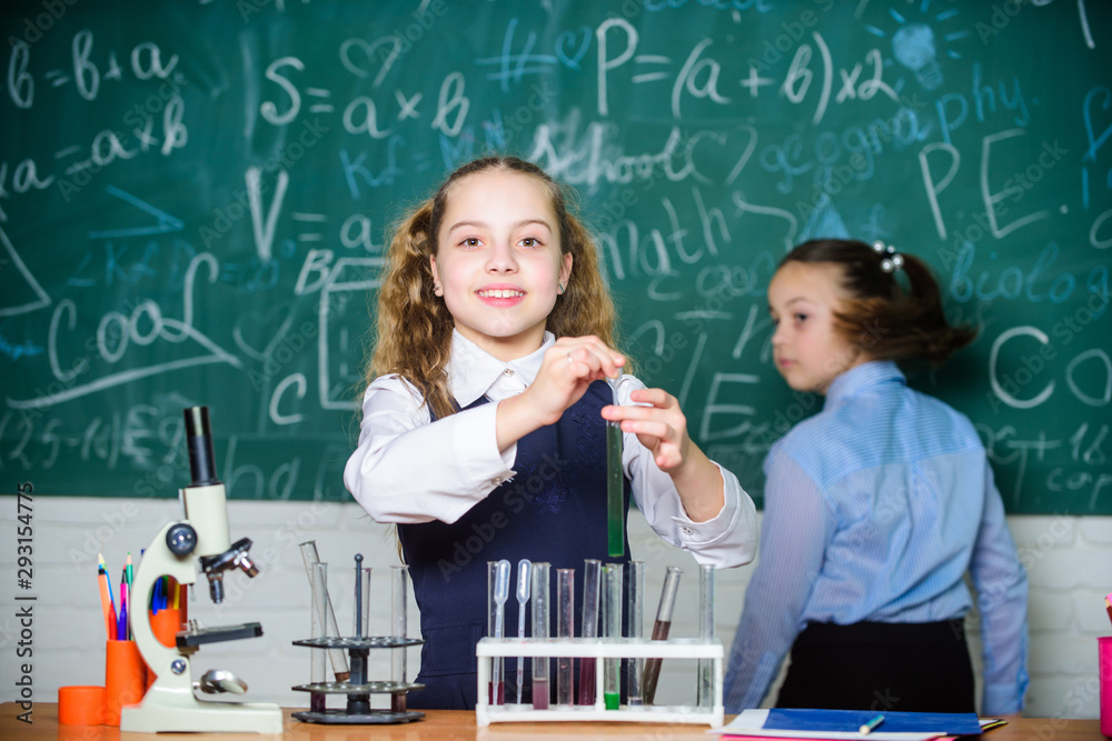 Laboratory glassware. School laboratory. Girl smart student conduct ...