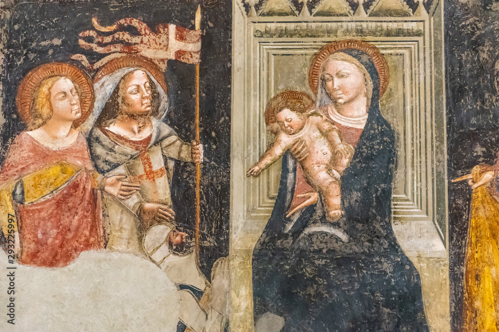 Religious medieval fresco showing Virgin Mary sitting on a throne ...