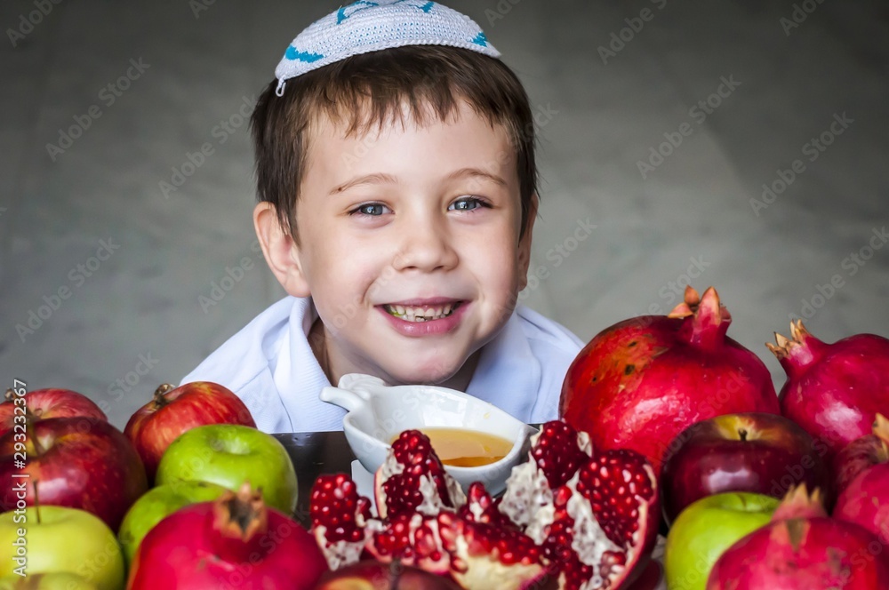 Cute adorable positive smiling Jewish Caucasian boy with a kippah on ...