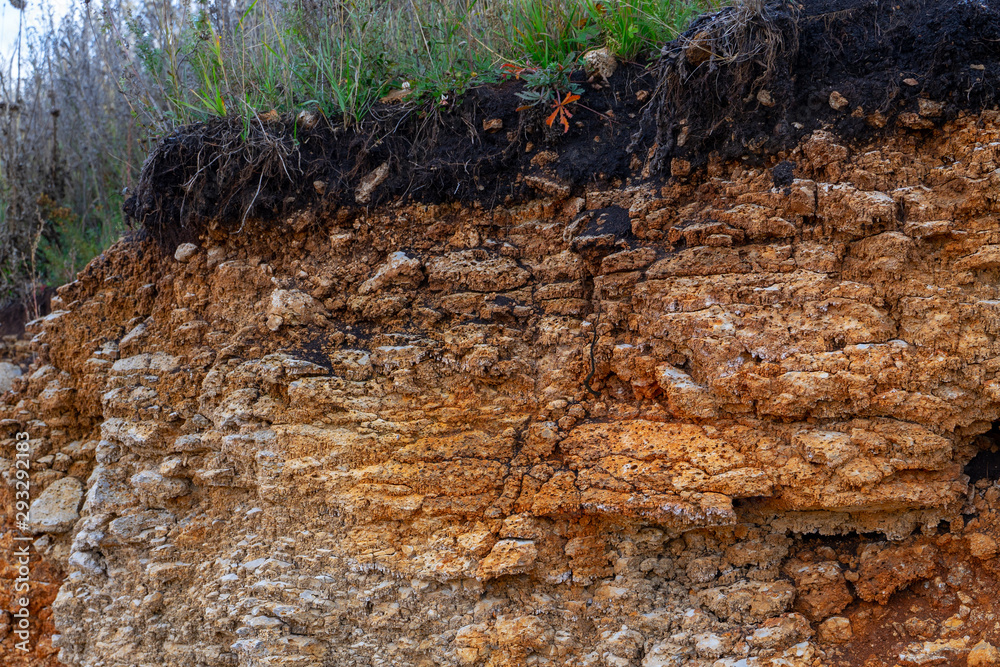 Soil cut-sandstone, stones, clay, sand structure and layers. slice of ...