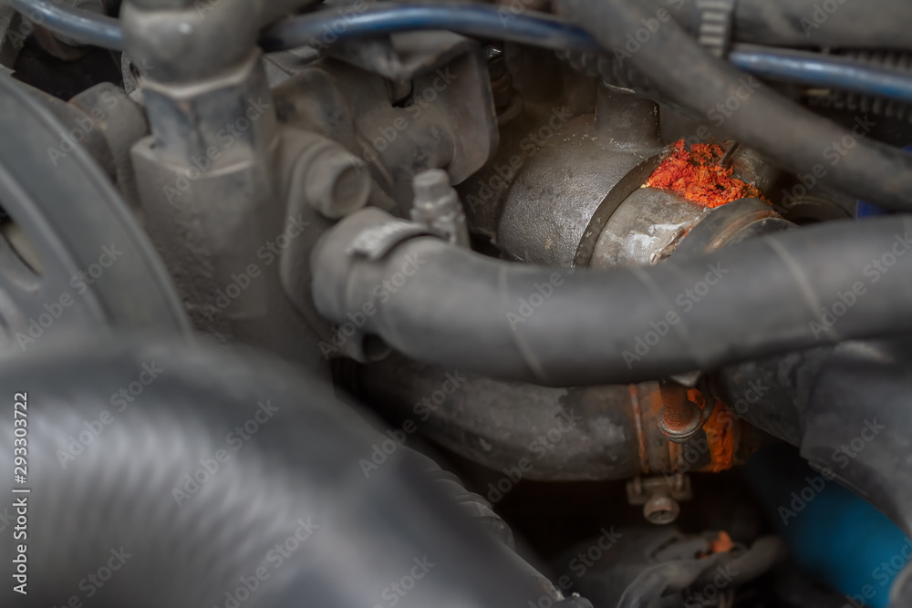 Close up leaked rusty from weathered liquid coolant pipe of cooling ...