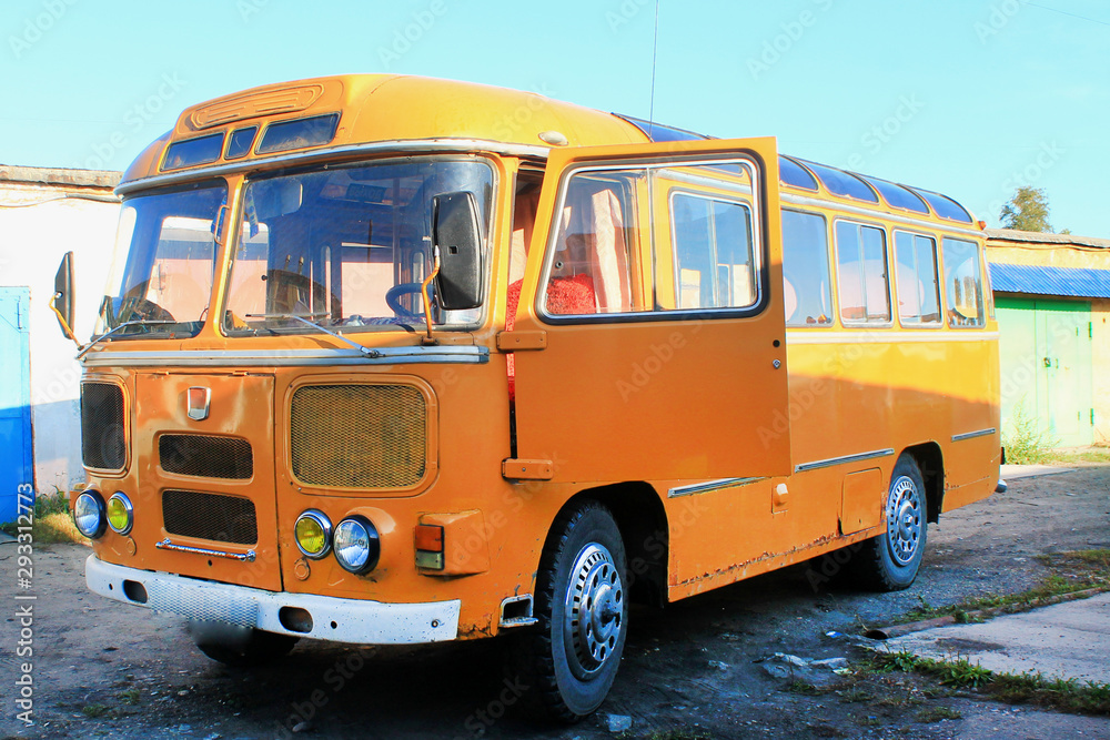 old yellow bus in vintage style on a yellow background. Urban transport ...