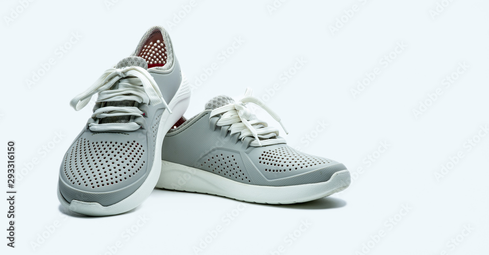 Foto de A pair of grey shoes on white background. Comfortable shoes ...