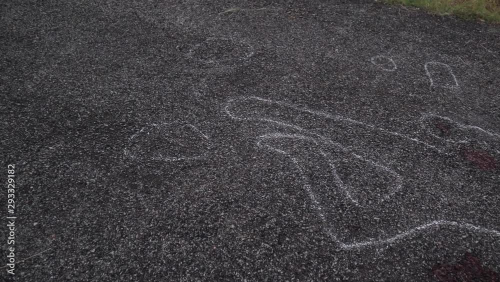 Pan View Medium shot of Crime scene chalk outline of victim dead body ...