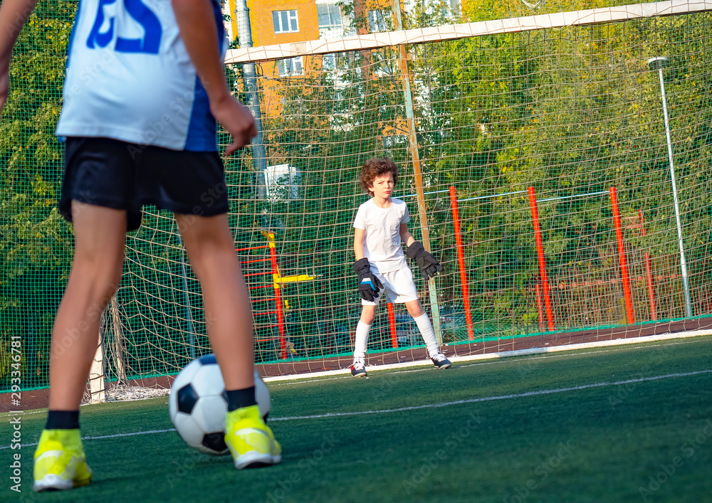 Kids play football on outdoor field. Football pitch. Sports training ...