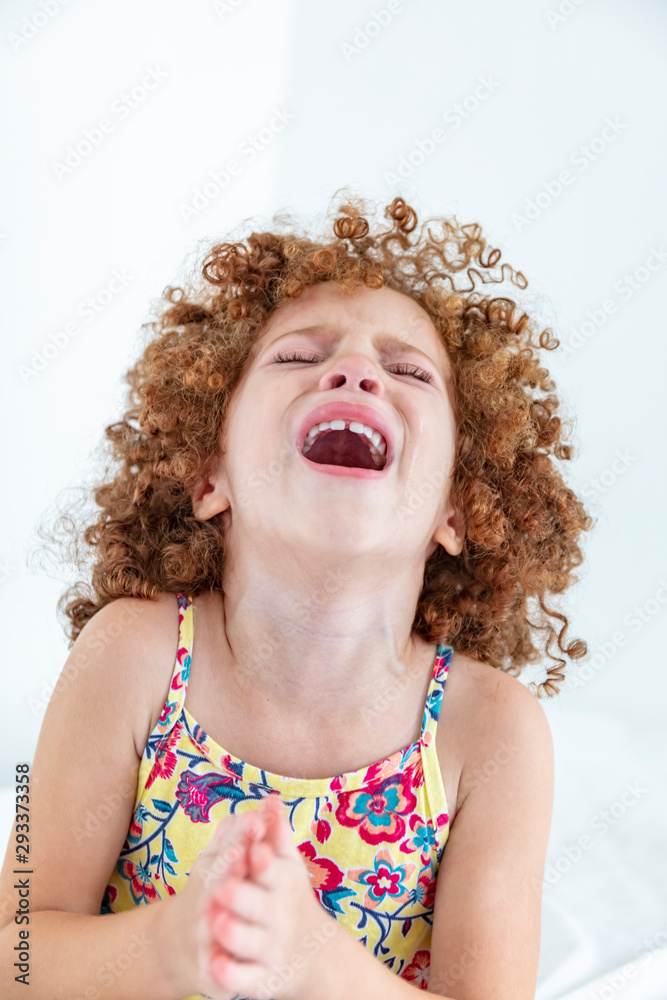 Beautiful sad girl crying in bed after sleepover, fell bouncing Stock ...