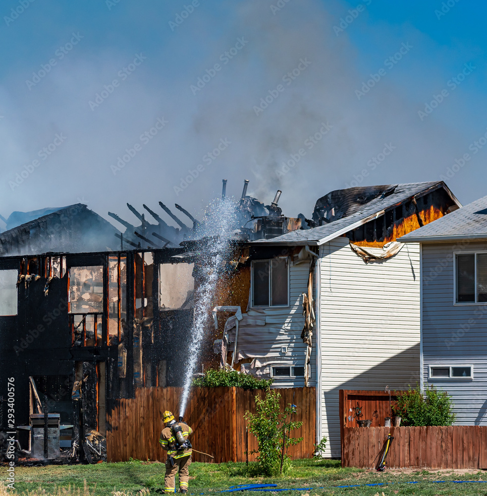 Firefighter at a Structure Fire Stock Photo | Adobe Stock