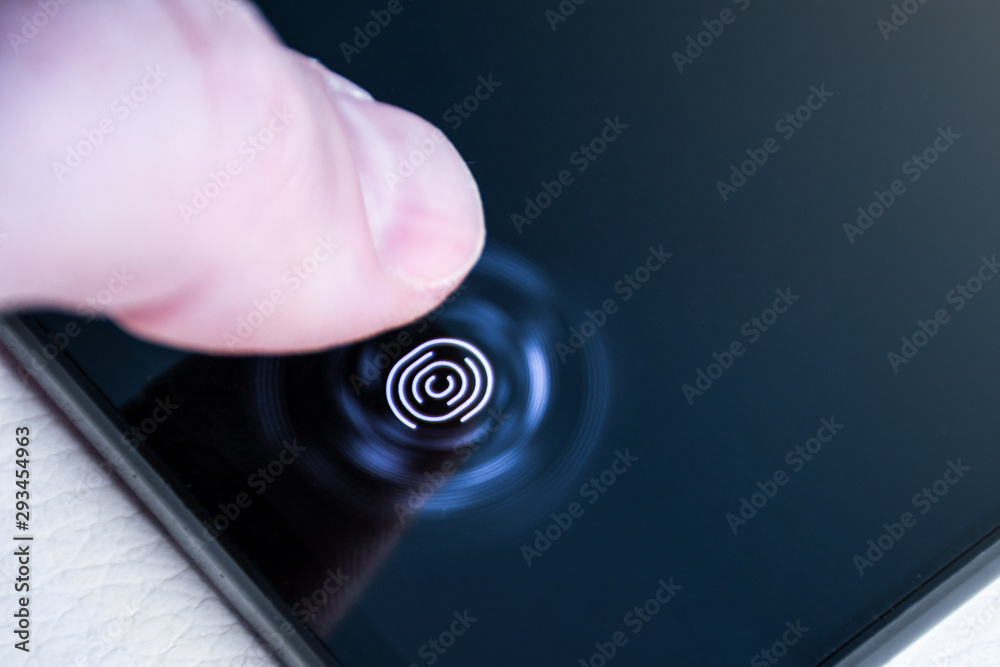 Unlocking the phone with the finger on a digital fingerprint scanner ...