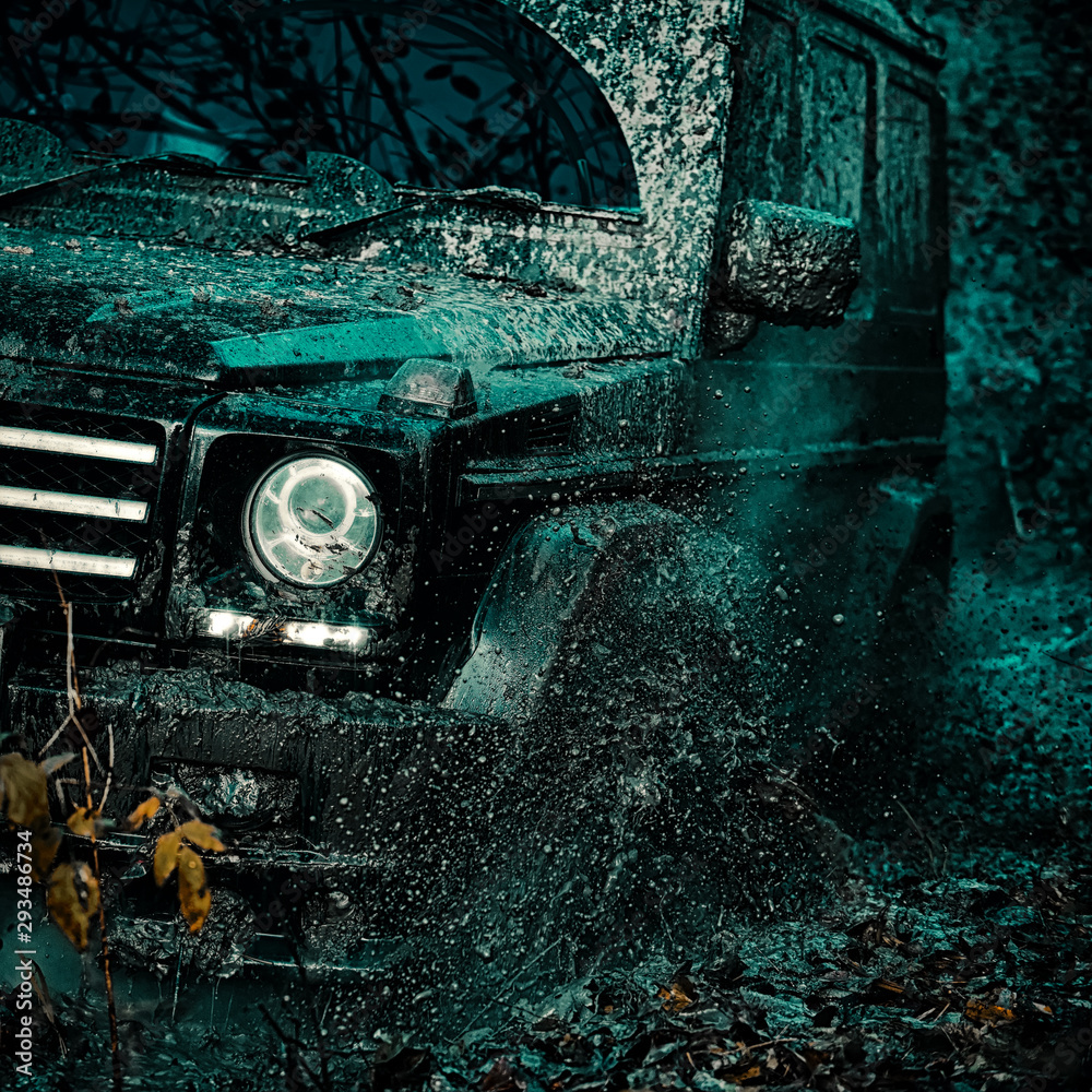 Off-road vehicle goes on mountain way. Bottom view to big offroad car ...