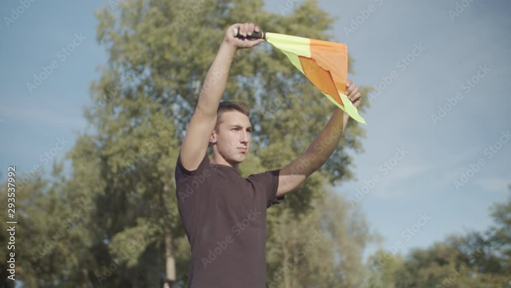 Video „Portrait of serious football assistant referee raising flag to ...