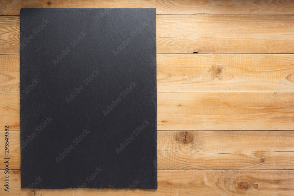 slate stone sign board at wooden plank Stock Photo | Adobe Stock