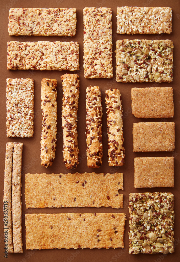 Assorted whole grain pastry snacks with seeds viewed from above. Flat ...