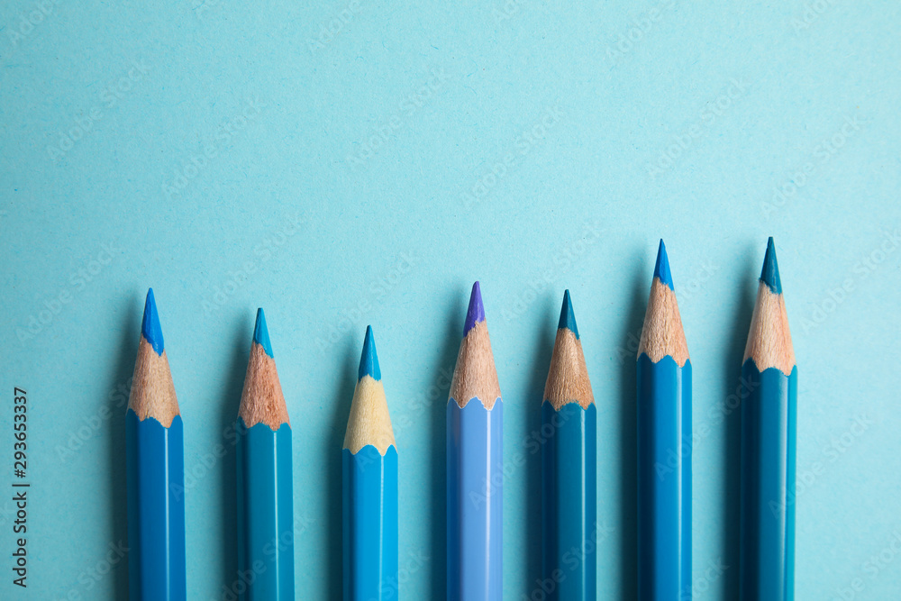 Flat lay composition with color pencils on light blue background Stock ...