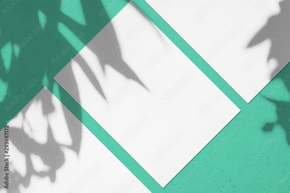 Three empty white rectangle poster or card mockups lying diagonally ...