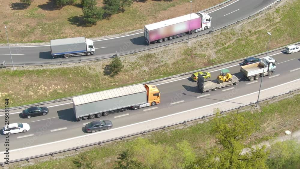 AERIAL: Two lorries driving down the highway during a traffic ...