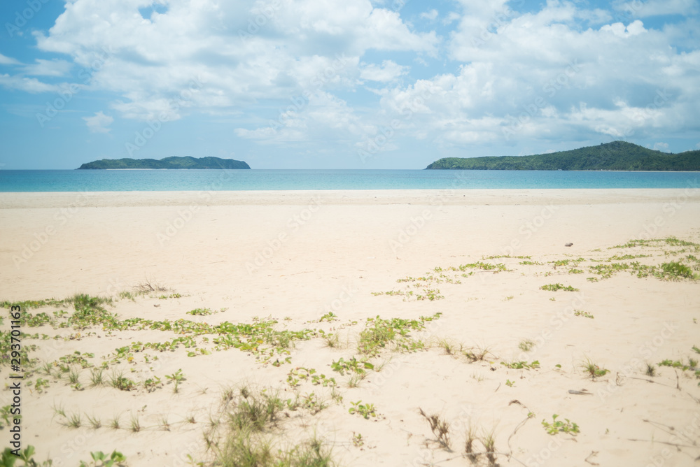 Sandy beach photo from low horizon eye level tourist camera at the edge ...