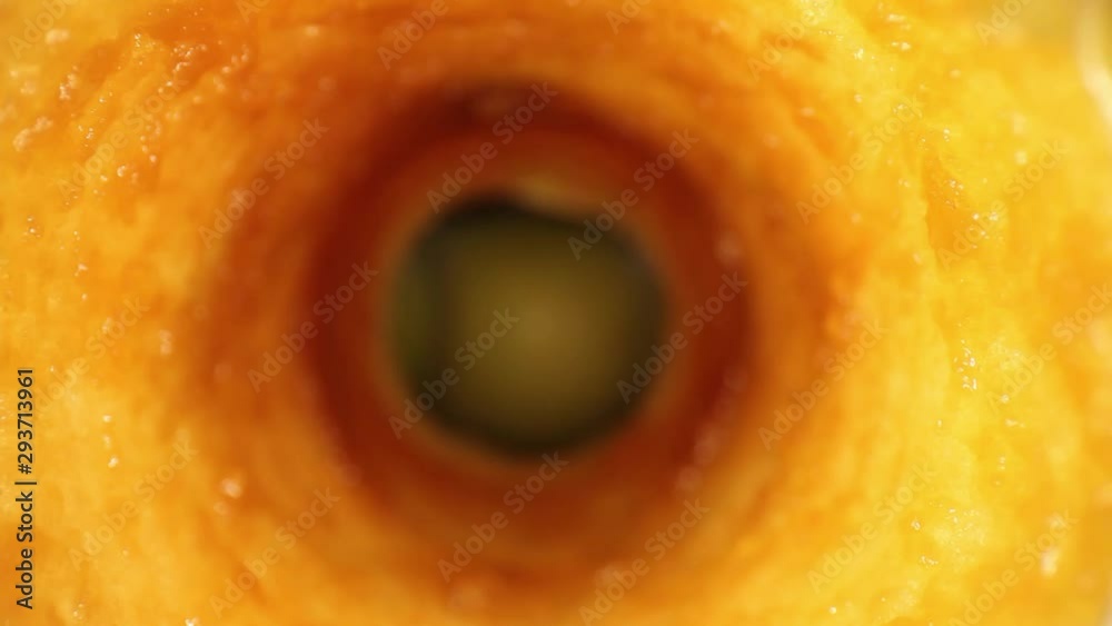 Pushing slowly towards the interior of an apple core that is heavily ...