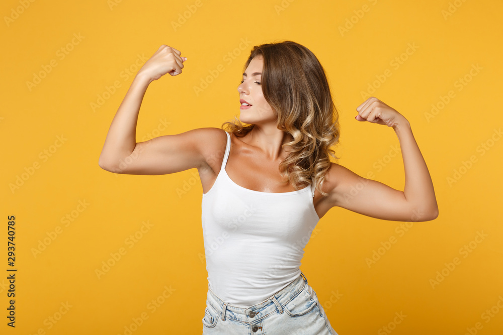 Strong young woman girl in light casual clothes posing isolated on ...