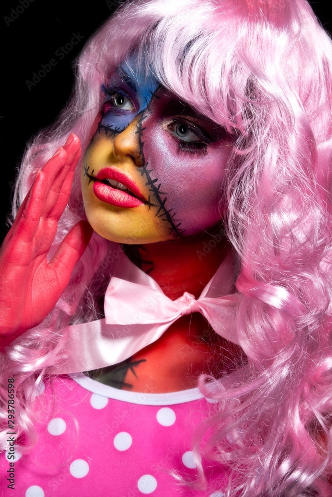 Girl in the suit and the image of a terrible dead doll with a sewn ...