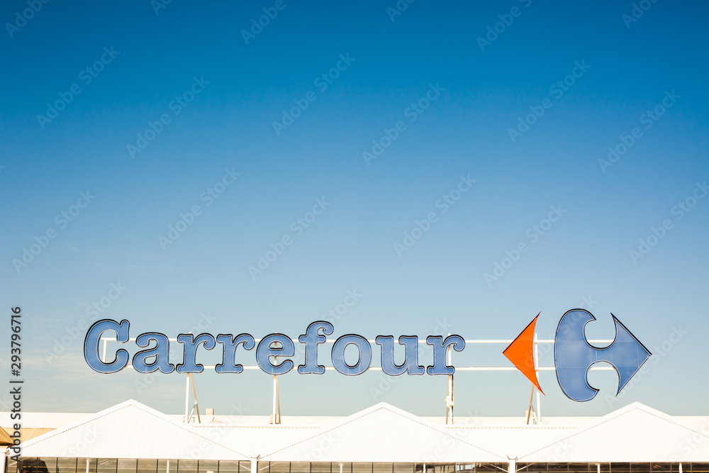 Carrefour supermarket chain brand logo at building Stock Photo | Adobe ...