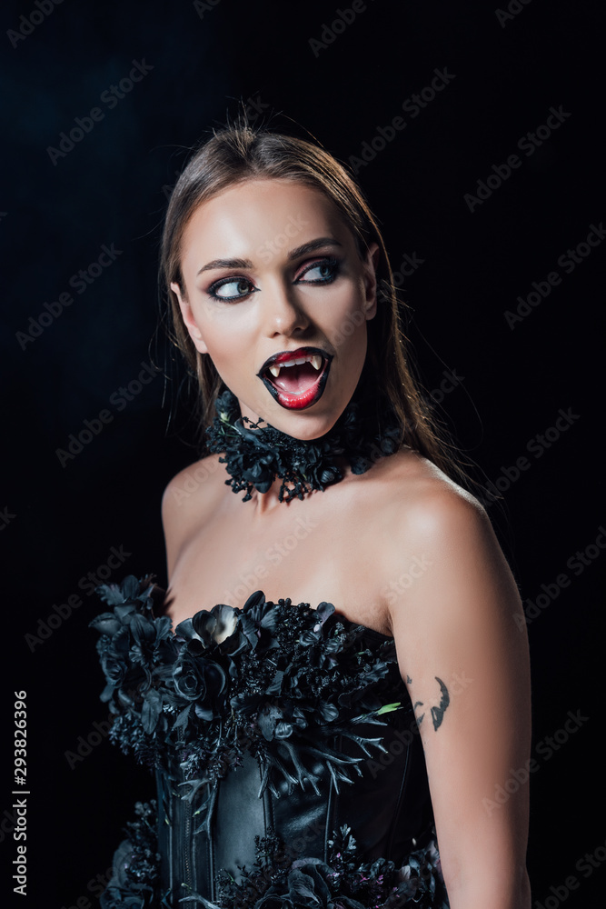 scary vampire girl with fangs in black gothic dress with open mouth ...