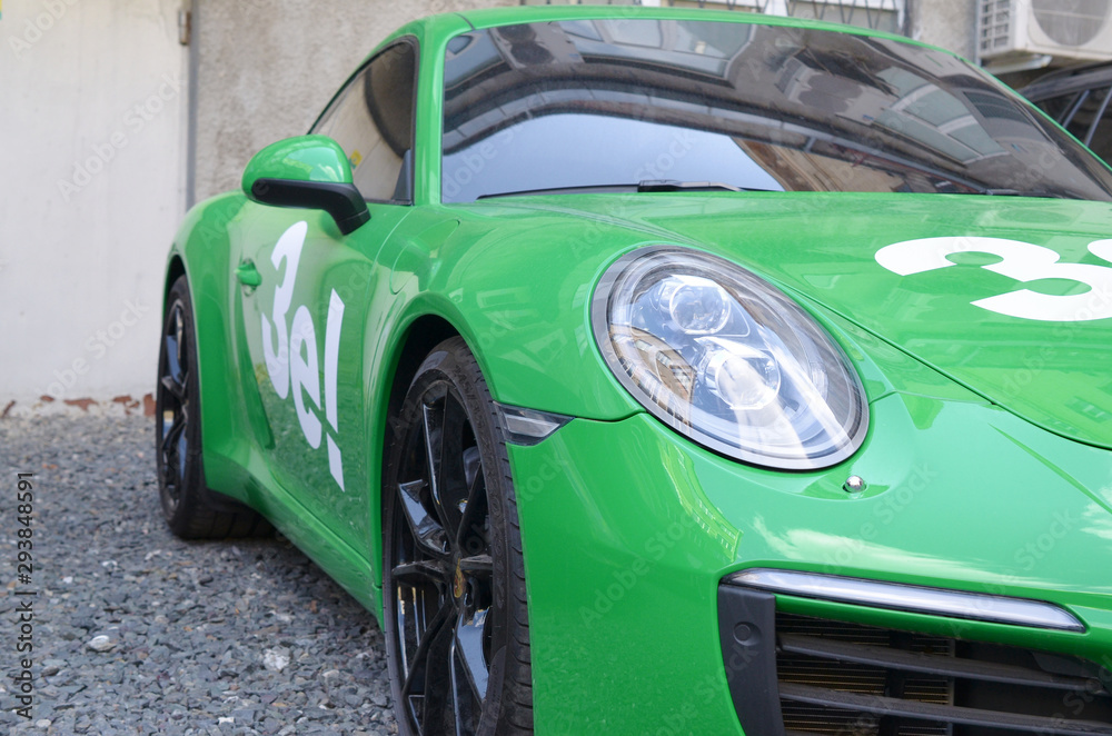 Porsche 911 Carrera 4S in green color with white stickers of Ze Team ...