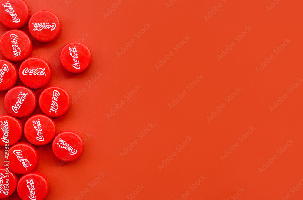 Many red caps with coca cola logo on red background Stock-Foto | Adobe ...