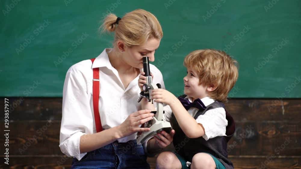 Kid and his physics teacher making experiment and work tools in ...