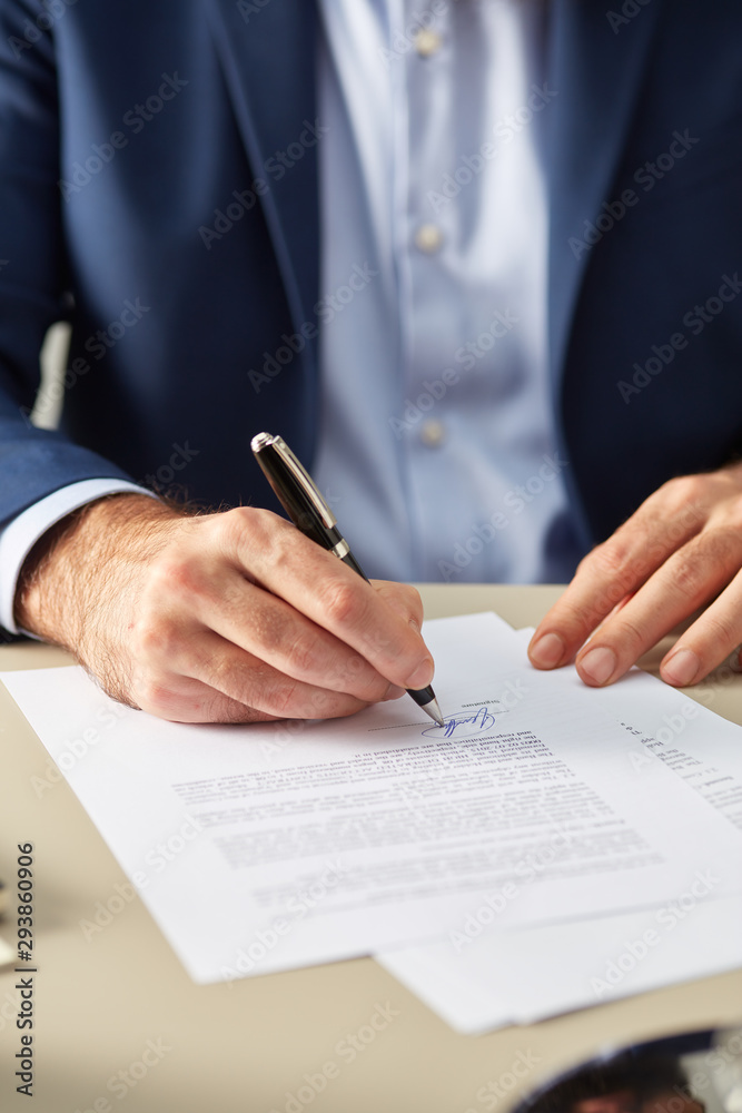 Contemporary elegant businessman signing document Stock Photo | Adobe Stock