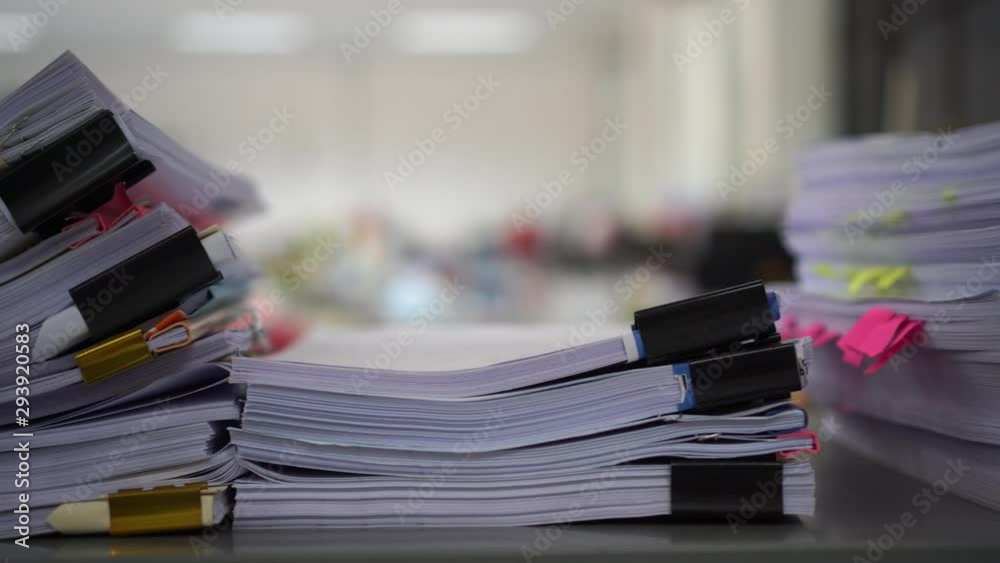 Piles unfinished documents reports files with overwork paper corner on ...