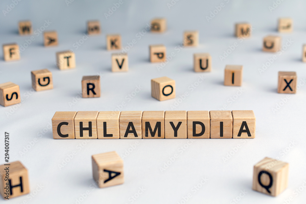 Chlamydia - word from wooden blocks with letters, parasitic bacterium ...