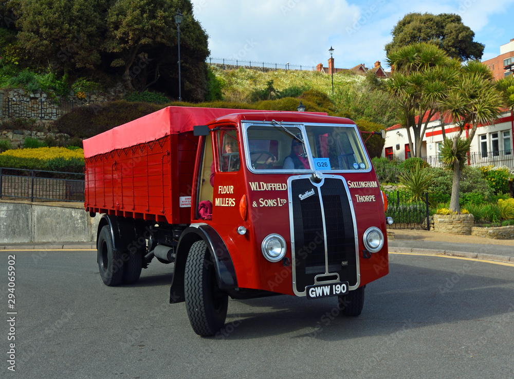 Vintage red Sentinel Truck being driven on road. Stock Photo | Adobe Stock